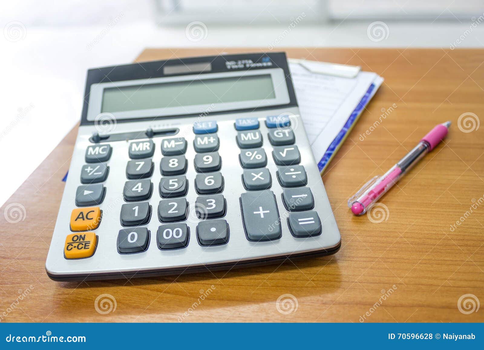 Calculator on wood table stock photo. Image of business - 70596628