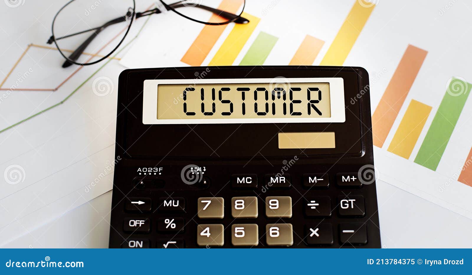 Calculator with the Word CUSTOMER on the Display with Chart and Glasses ...