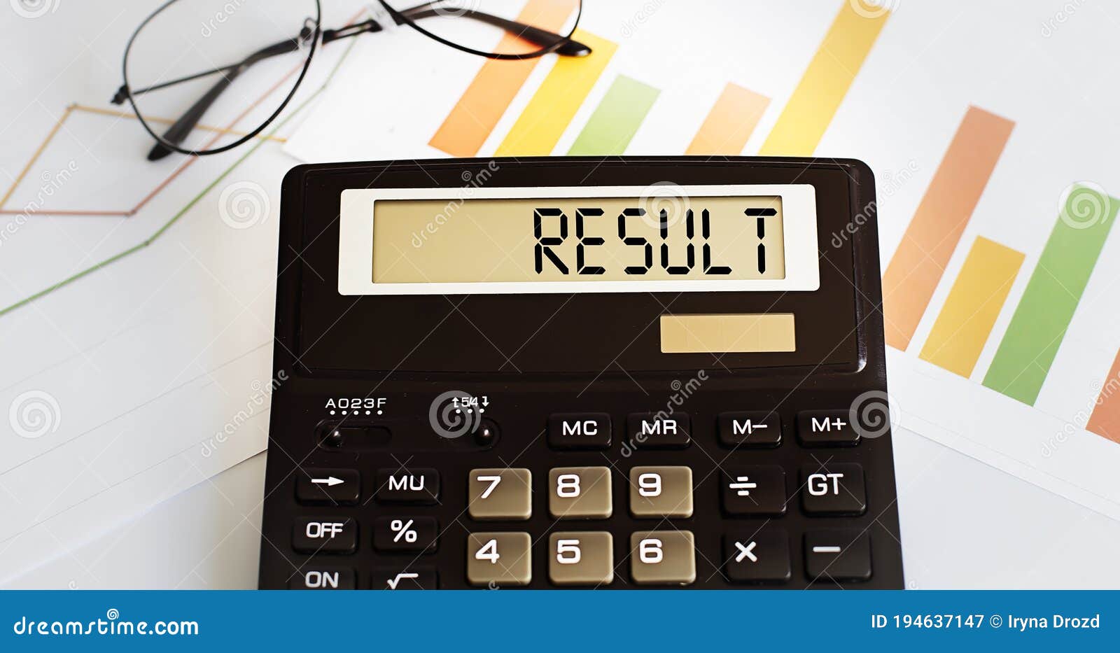 Calculator with the Word RESULT on the Display with Chart and Glasses ...
