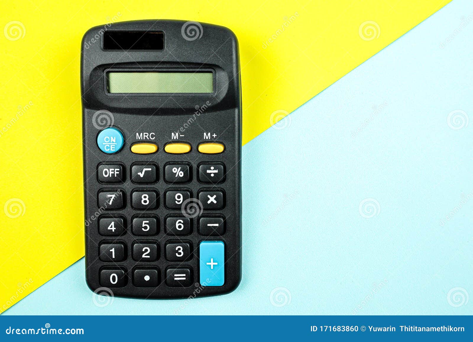 A Calculator on Yellow and Blue Background. Stock Photo - Image of ...