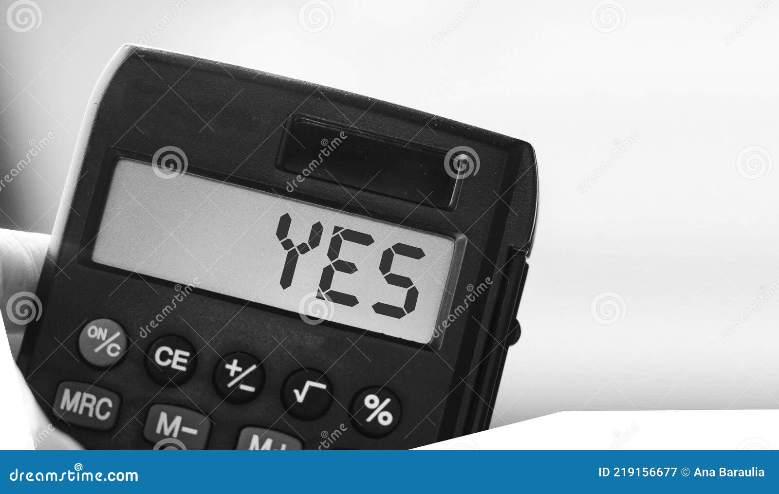 Calculator with YES on Display on Blue Blured Background. Positive ...
