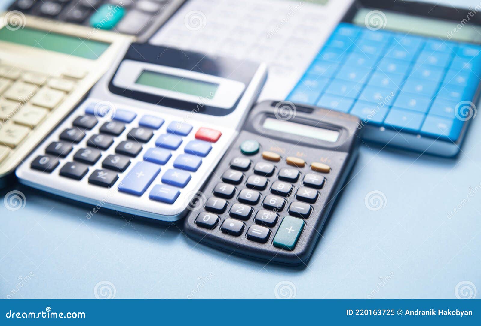 Calculators on the Blue Background Stock Image - Image of office ...