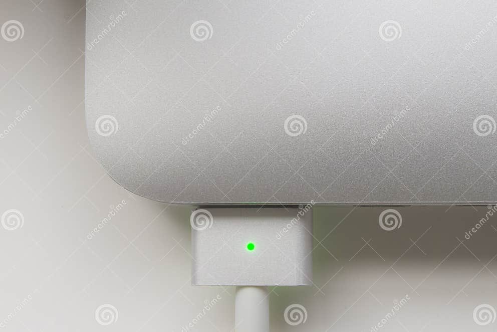 Macro Close Up MacBook Computer Charging during the Night Top View ... Macro Close Up MacBook Computer Charging during the Night Top View ...