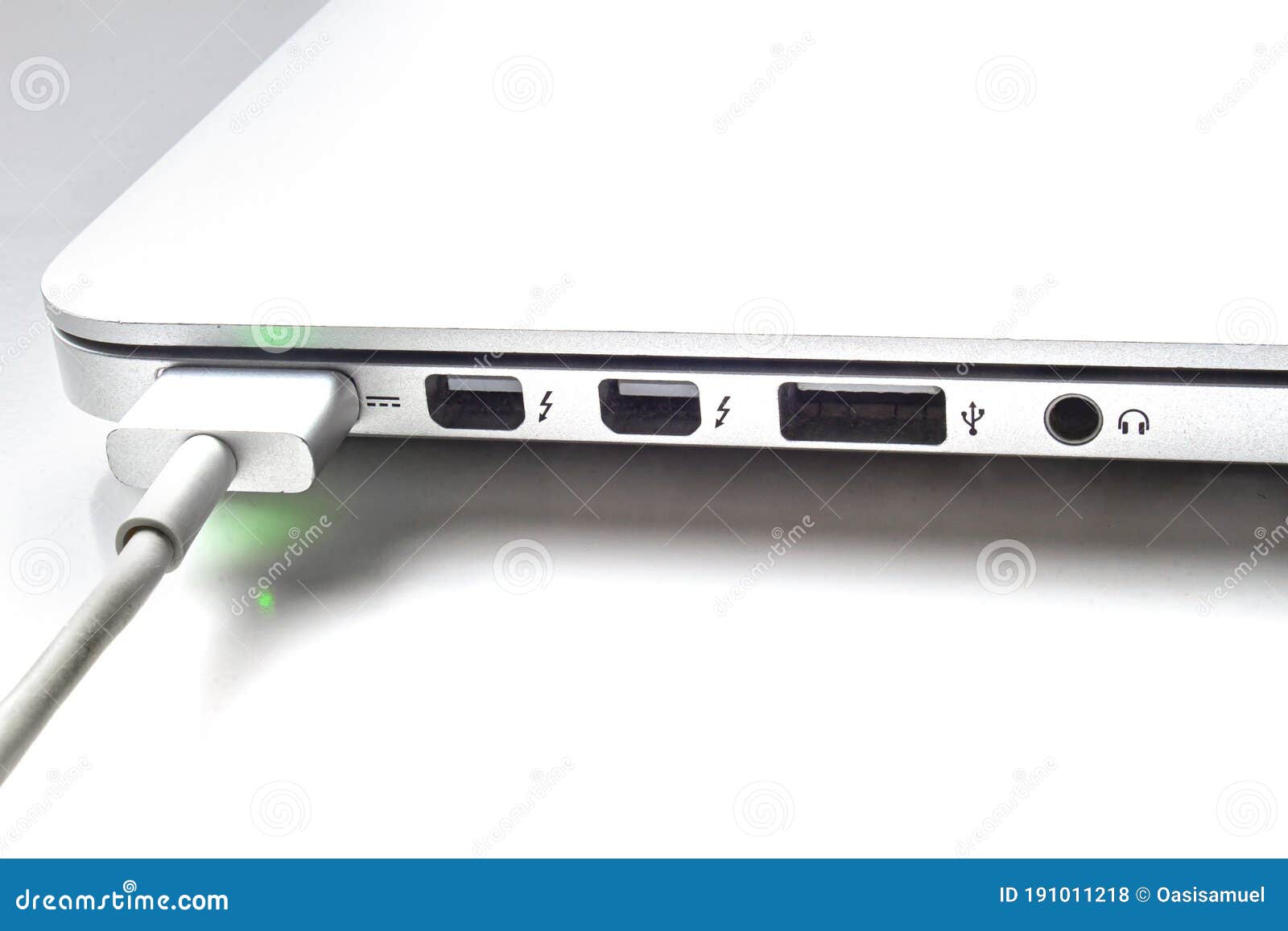 Side View of a MacBook Computer Charging during the Night Top View ... Side View of a MacBook Computer Charging during the Night Top View ...
