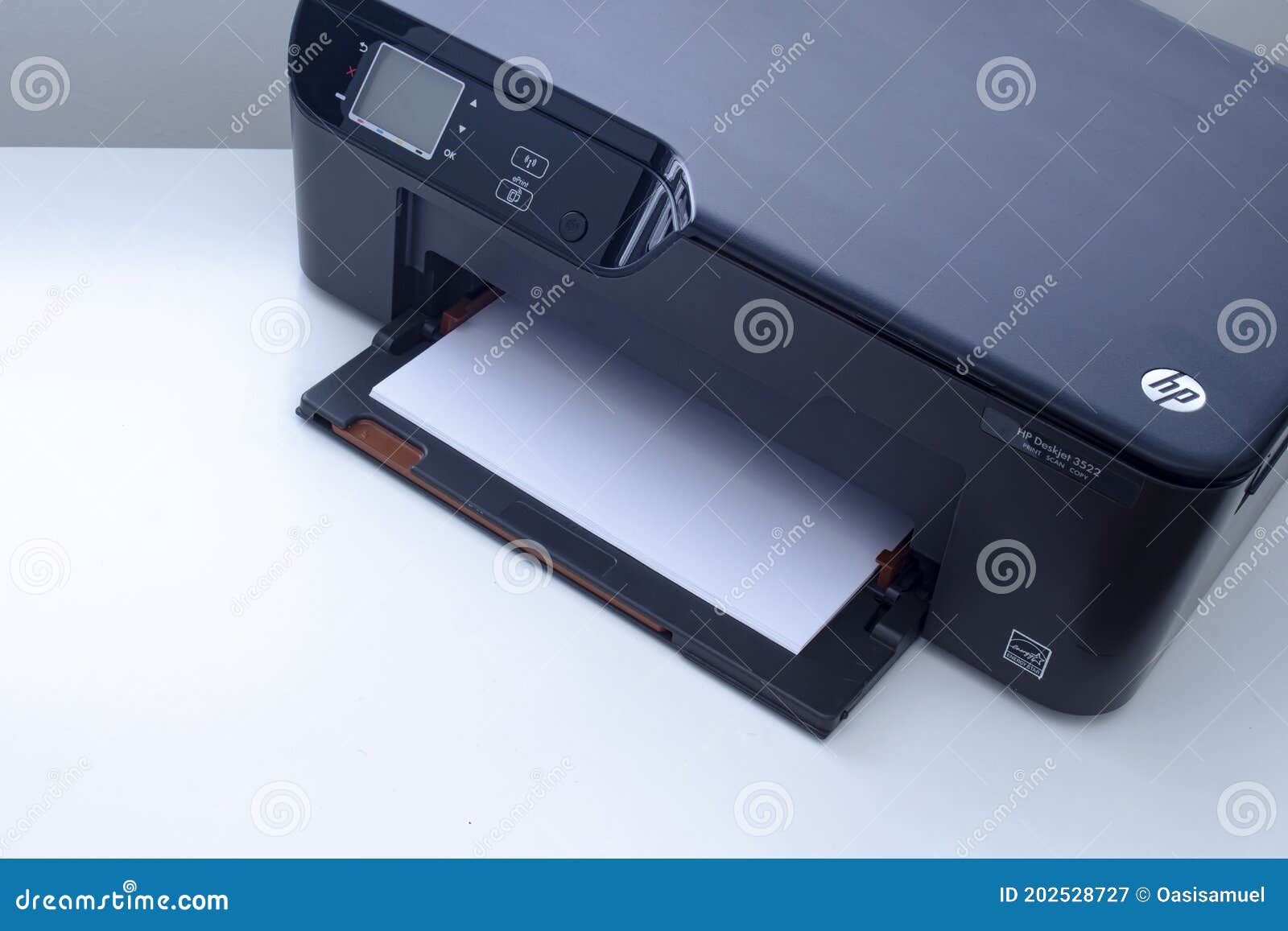 An HP Deskjet 3522 E-All-in-One Printer on a White Table Editorial ...