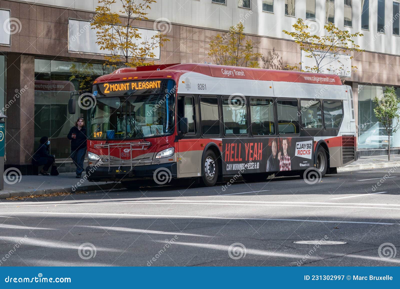 Calgary Transit Bus Waiting at a Bus Stop Editorial Photography - Image ...