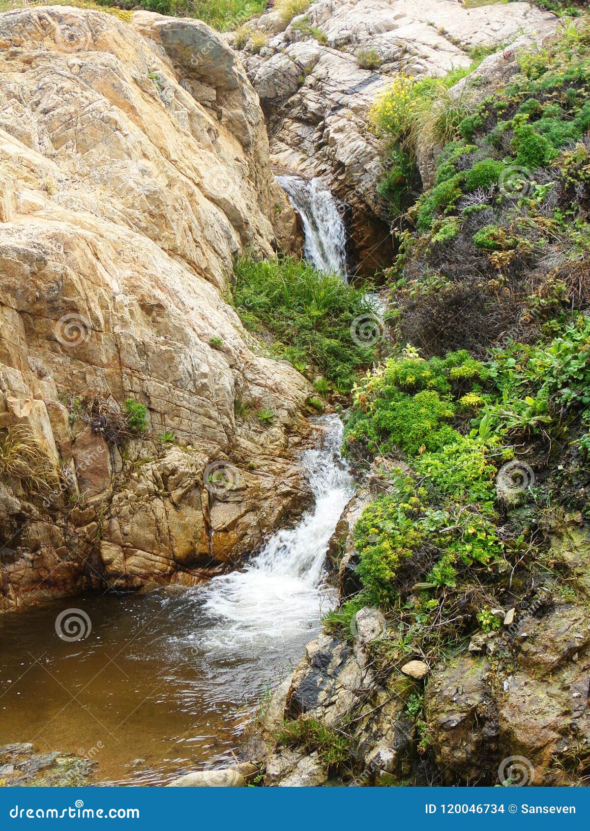 California Coastal Rocks and Cliffs, Small Cascading Waterfall Along ...