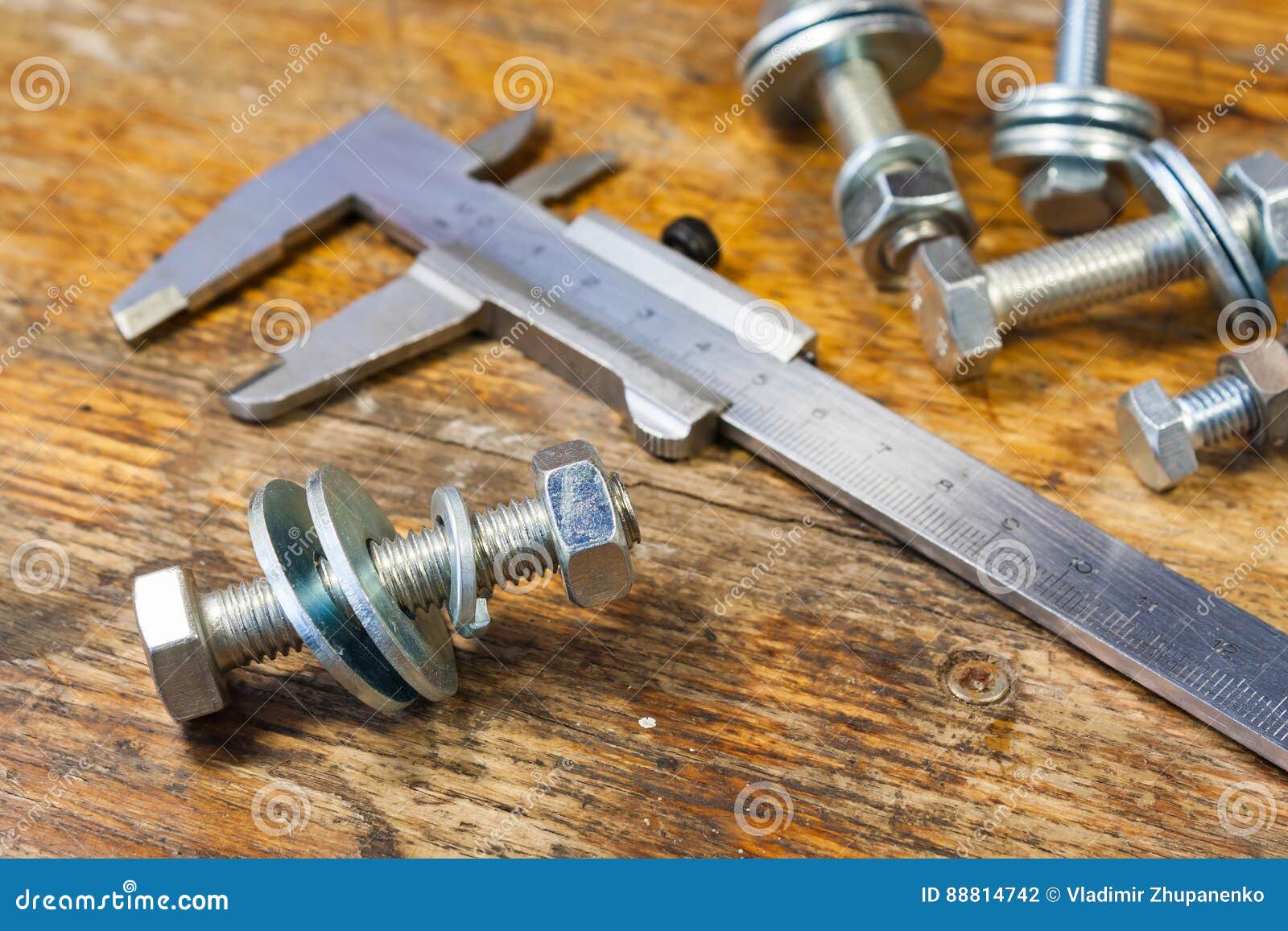 Caliper, Bolt and Nut on a Table in a Workshop Stock Photo - Image of ...