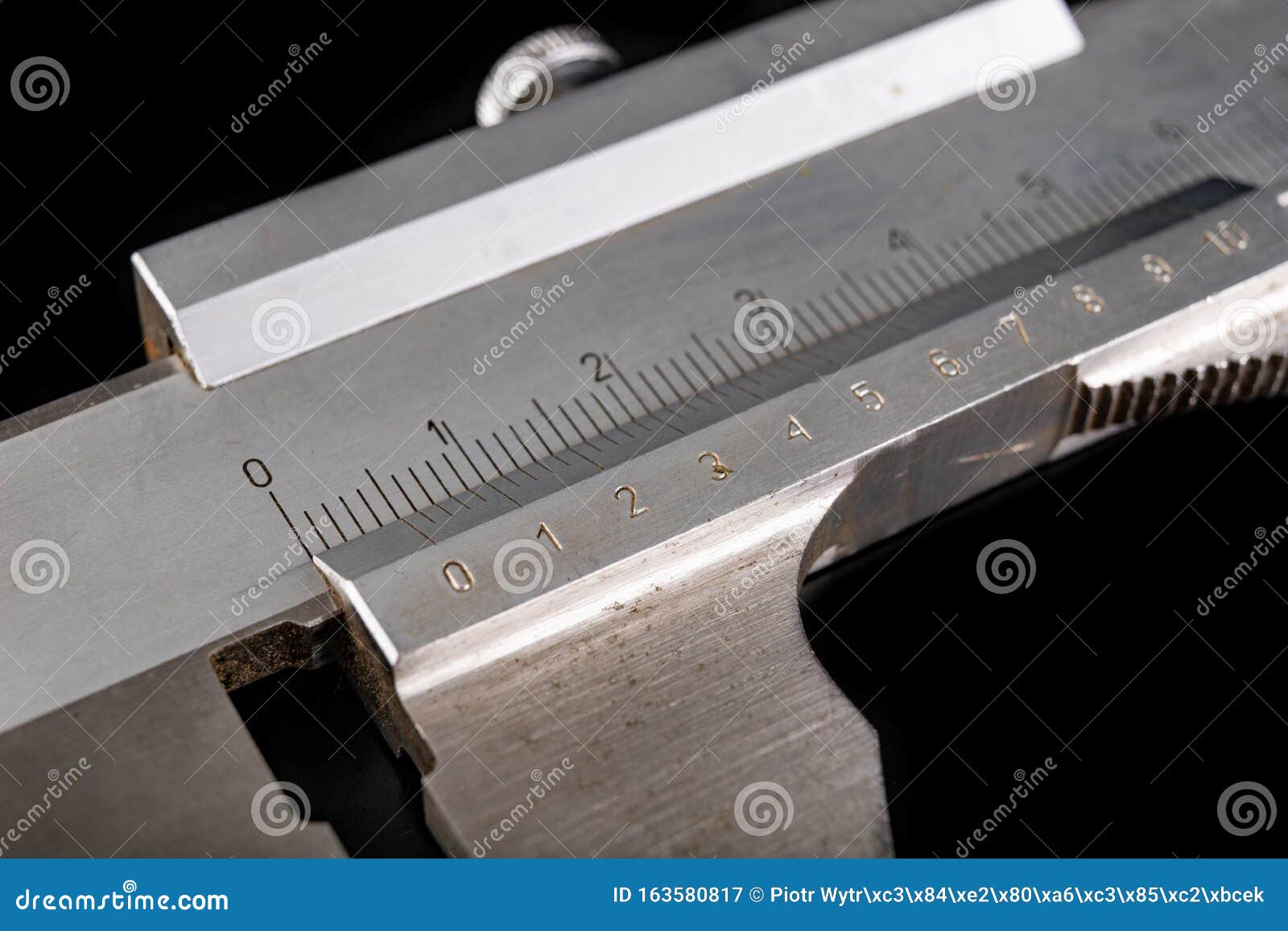 Caliper on a Dark Workshop Table. a Tool for Precise Measurement in the ...