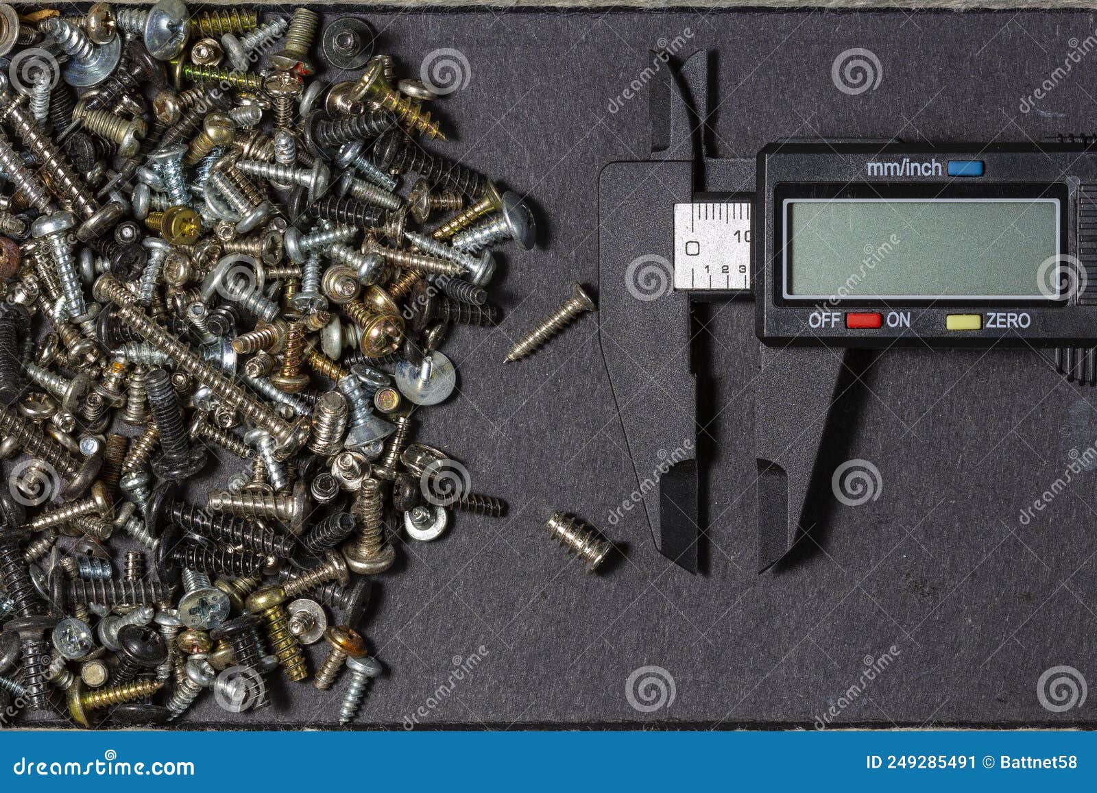 Caliper and Various Types of Fasteners on a Wooden Brown Background ...