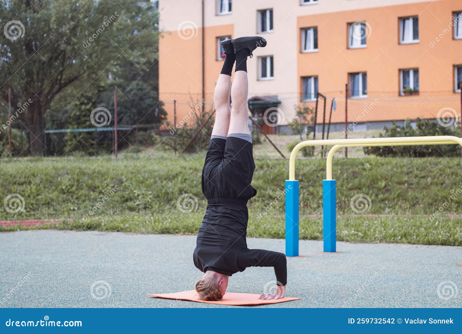 Calisthenics Athlete Performs a Headstand Using a Solid Core and Arm ...