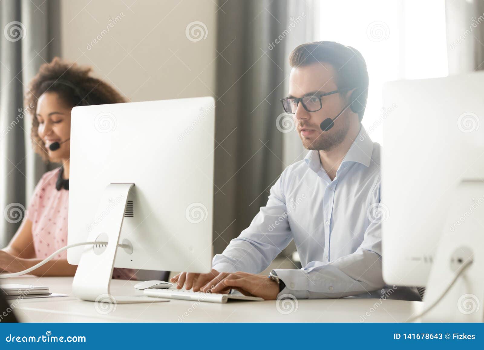 Call Center Agent in Headset Using Computer in Open Space Stock Image ...
