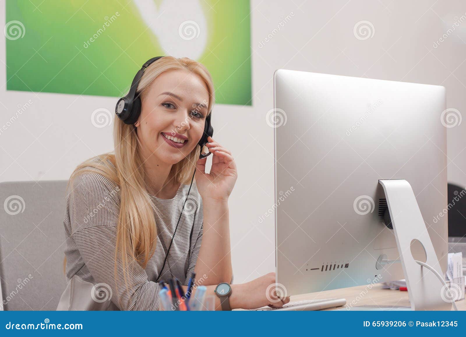 Call center agent at work stock photo. Image of communication - 65939206
