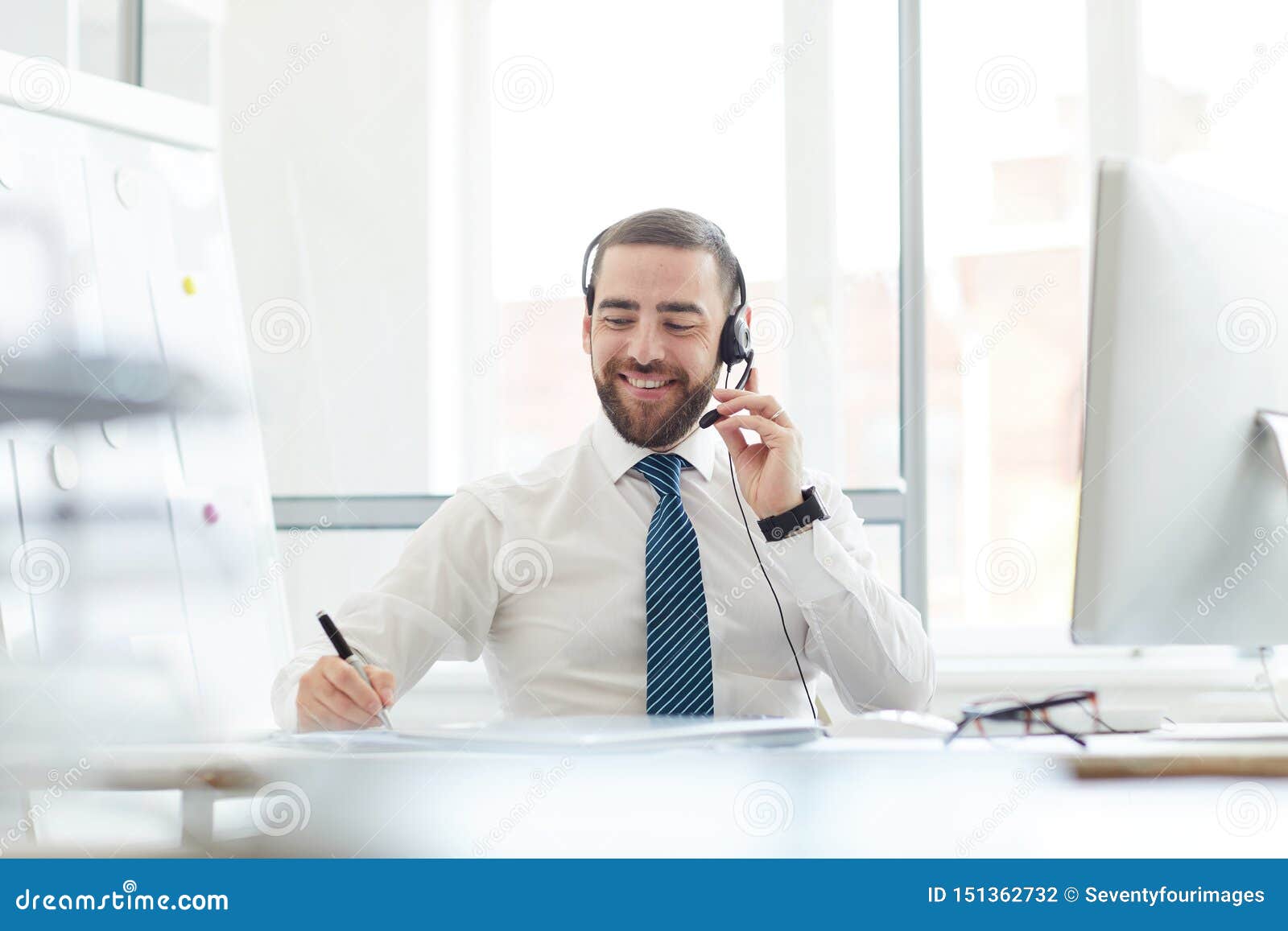 Call center agent at work stock photo. Image of adult - 151362732