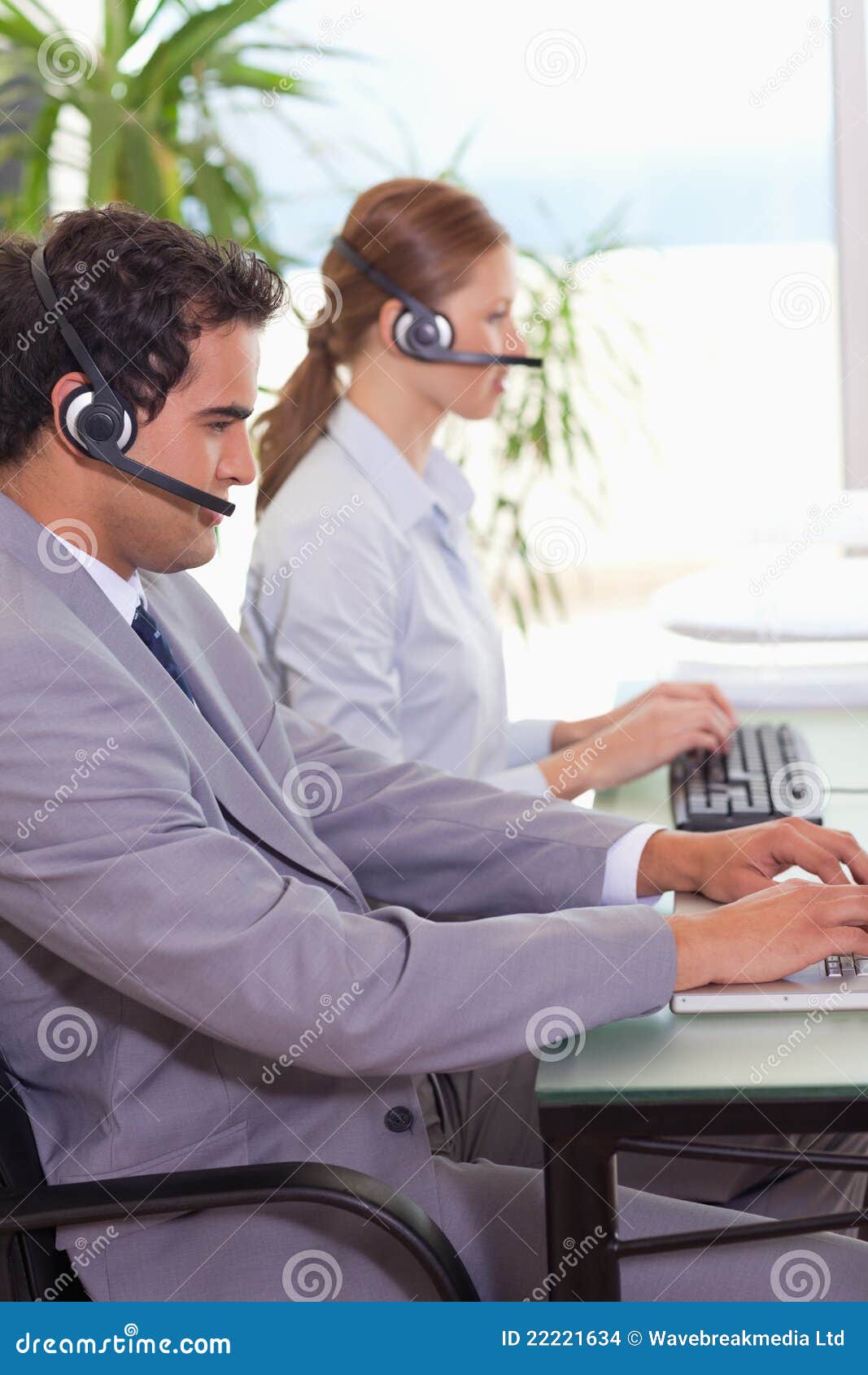 Call center agents at work stock photo. Image of speaking - 22221634