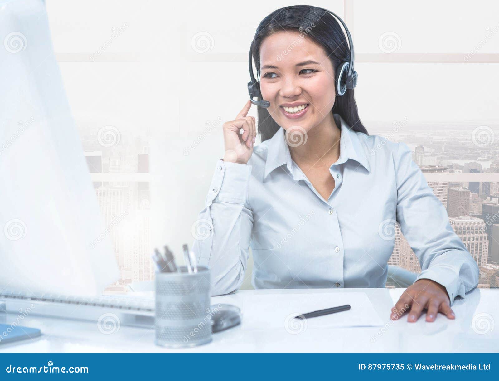 Call Center Executive Sitting at Desk and Talking on Headphones Stock ...