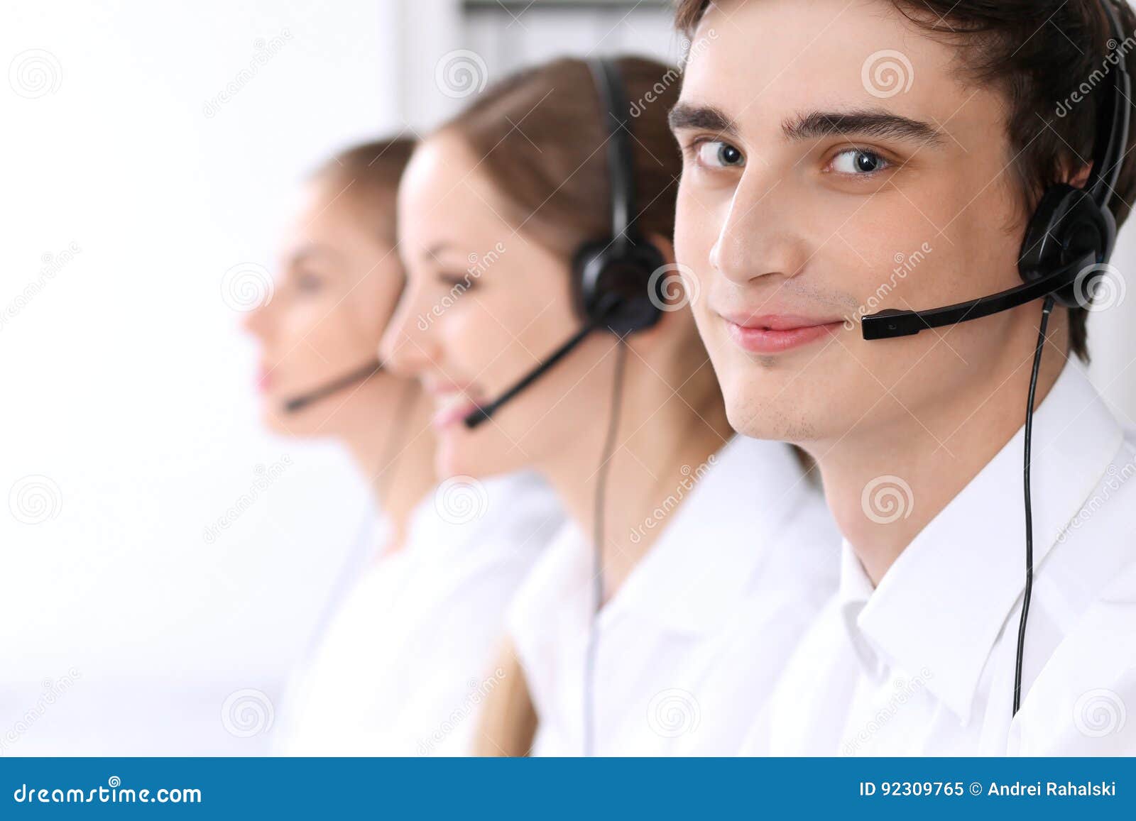 Call Center. Focus on a Man in Headset Stock Image - Image of team ...