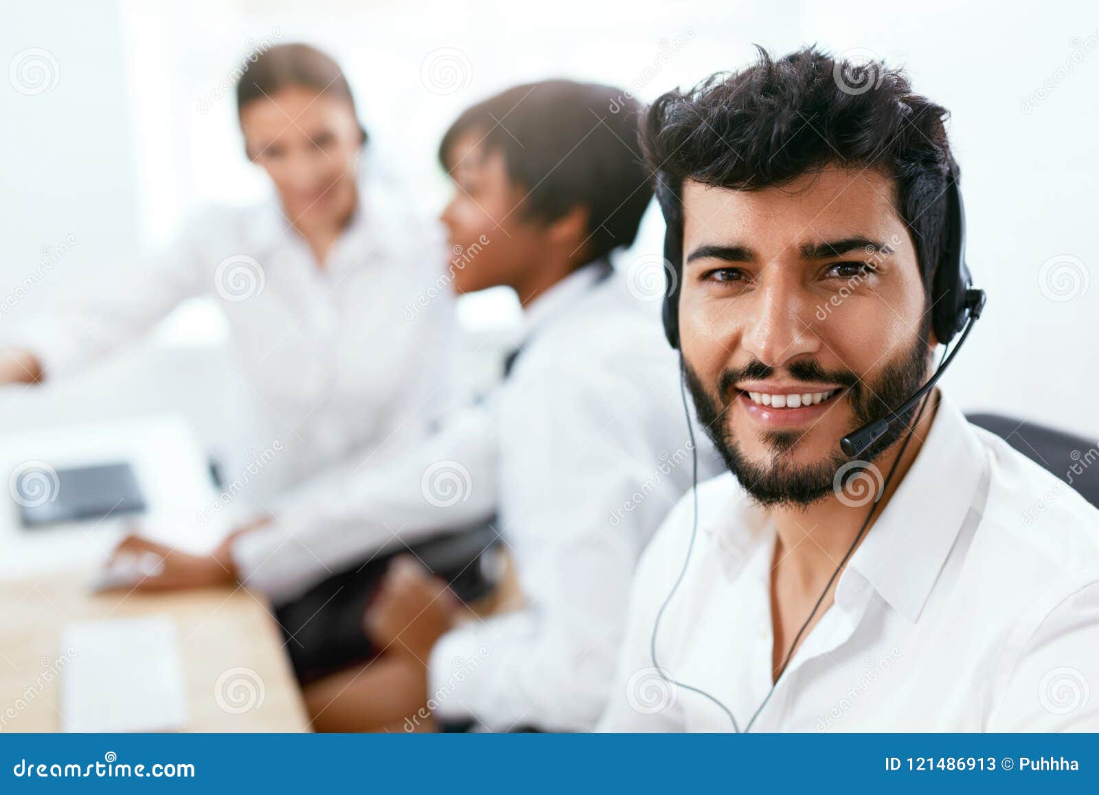 Call Center Operator with Colleagues at Workplace Stock Image - Image ...