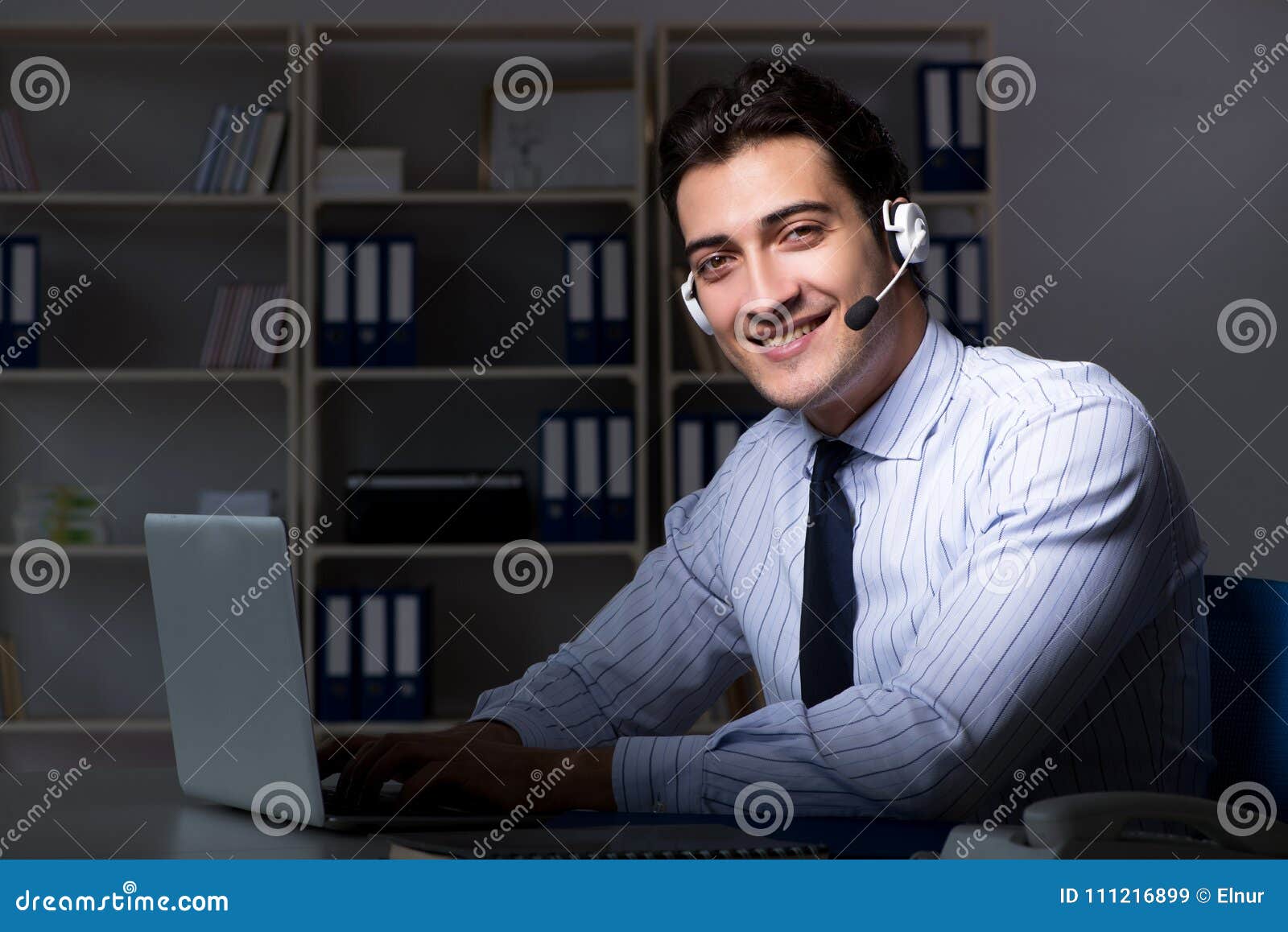 The Call Center Operator Talking To Customer during Night Shift Stock ...