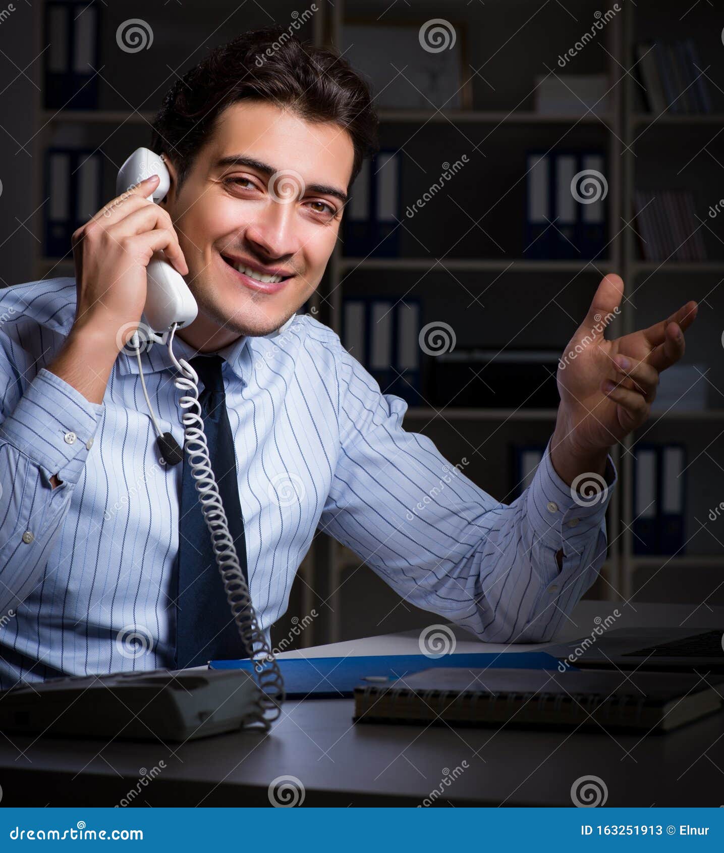 Call Center Operator Talking To Customer during Night Shift Stock Image ...