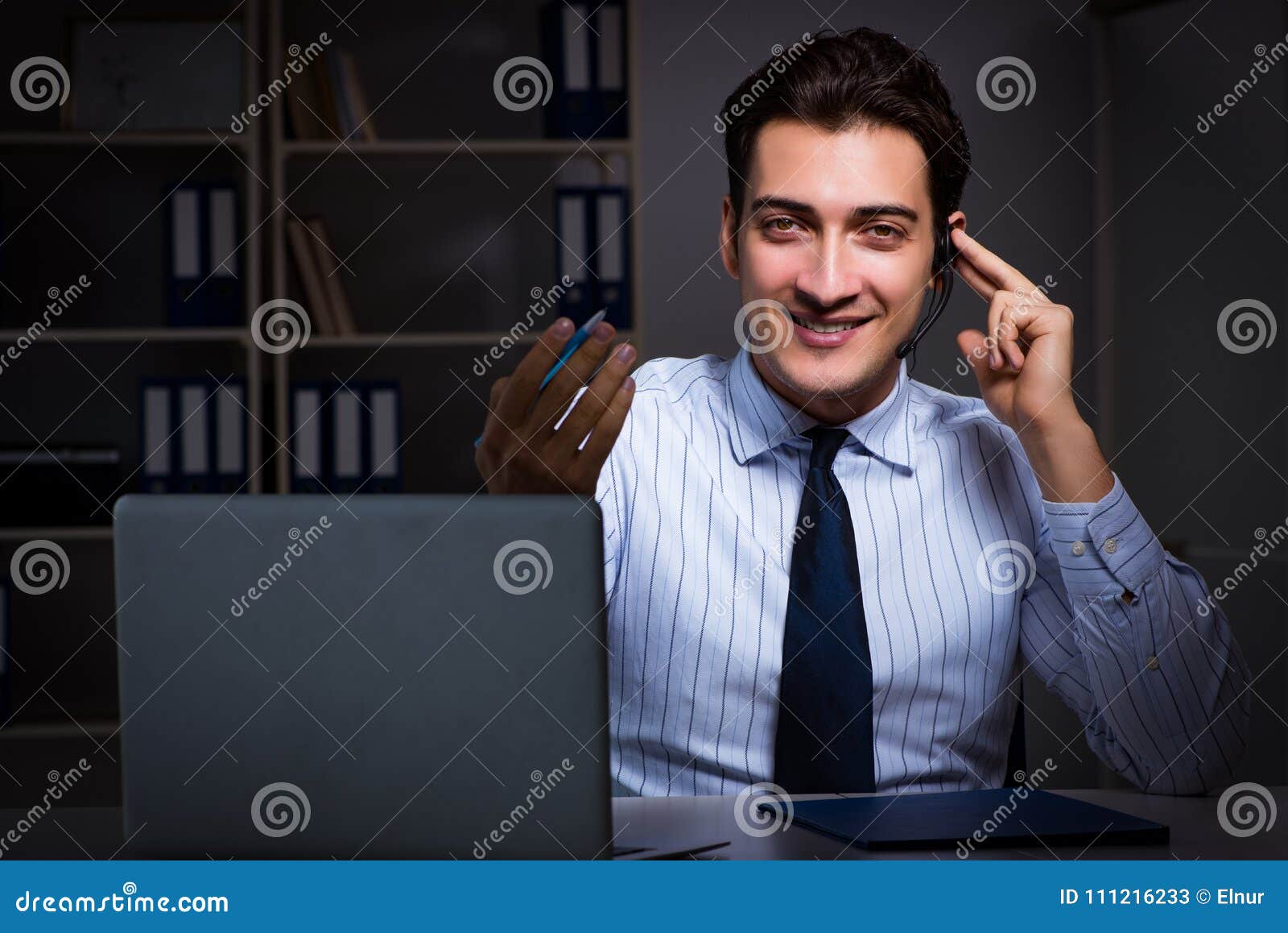 The Call Center Operator Talking To Customer during Night Shift Stock ...