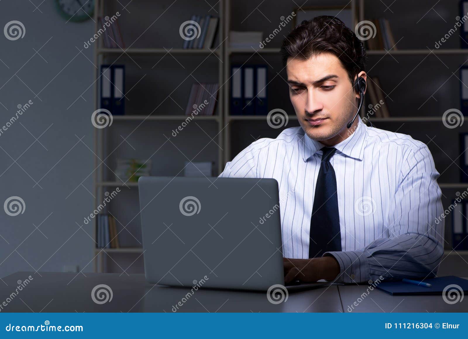 The Call Center Operator Talking To Customer during Night Shift Stock ...