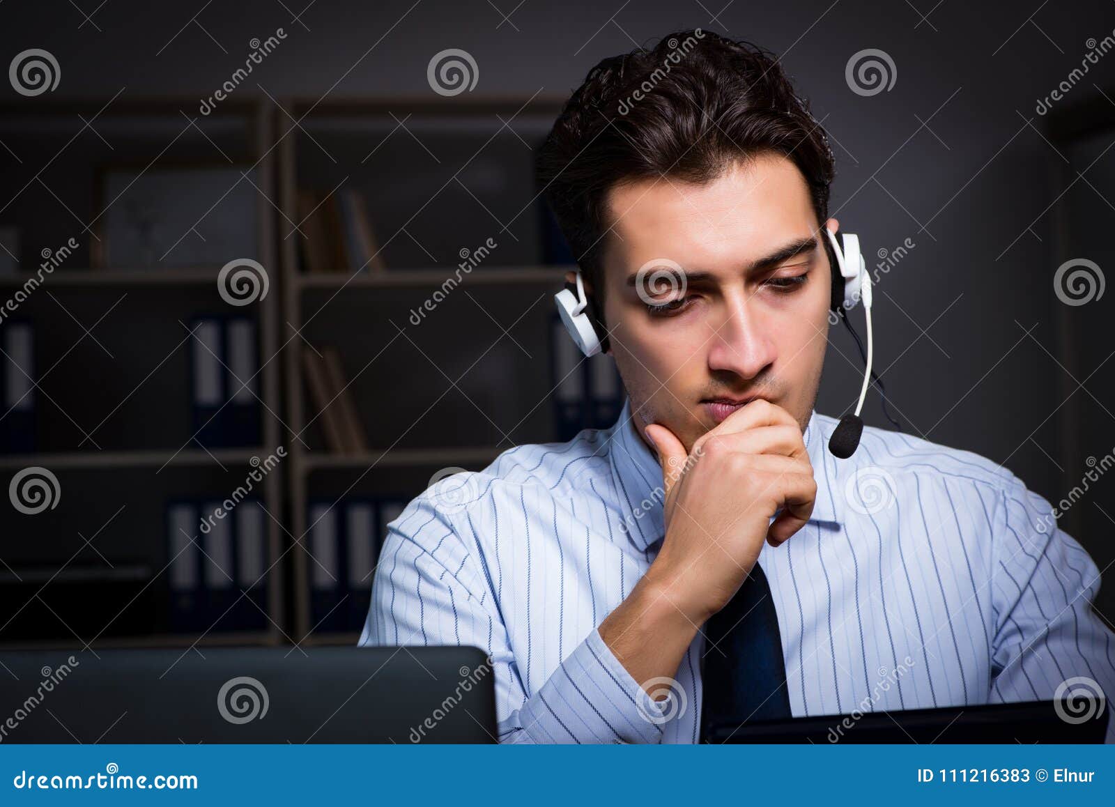 The Call Center Operator Talking To Customer during Night Shift Stock ...