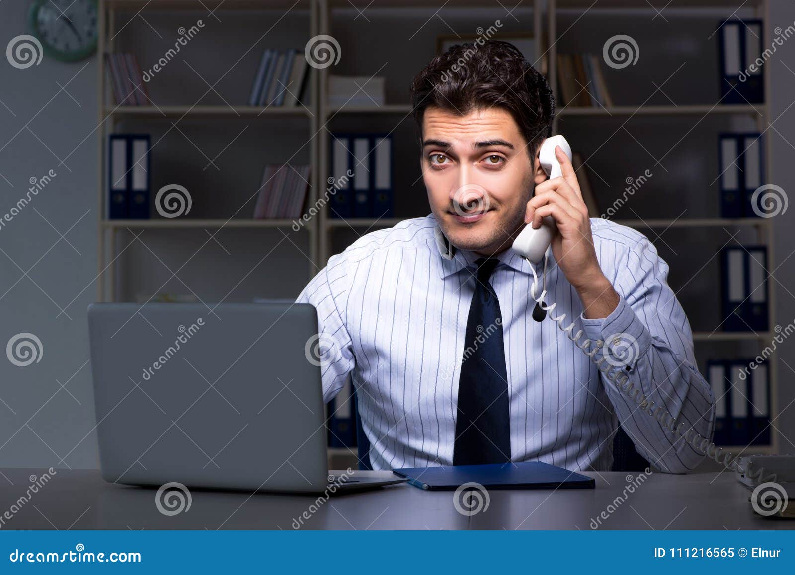 The Call Center Operator Talking To Customer during Night Shift Stock ...