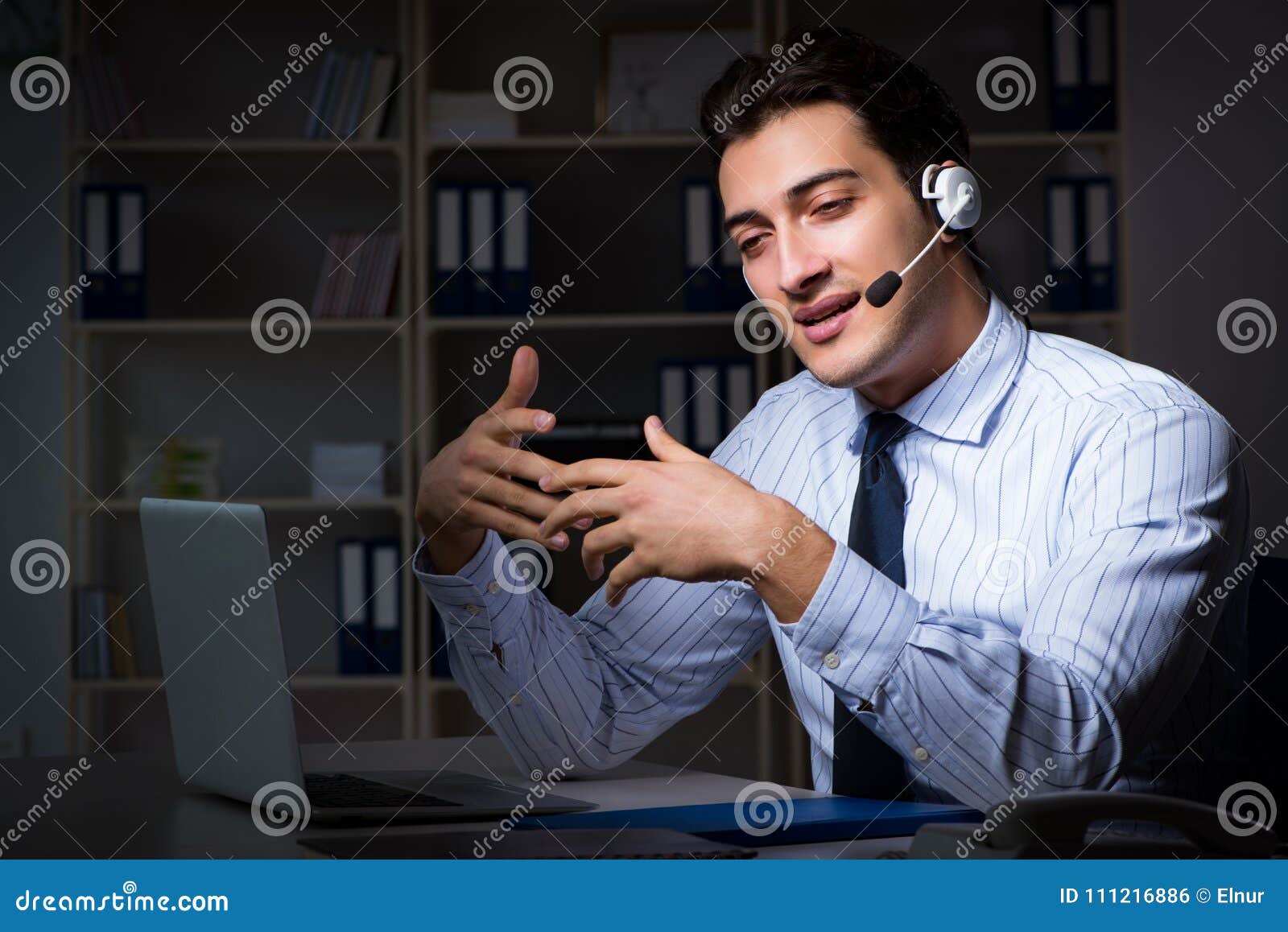 The Call Center Operator Talking To Customer during Night Shift Stock ...