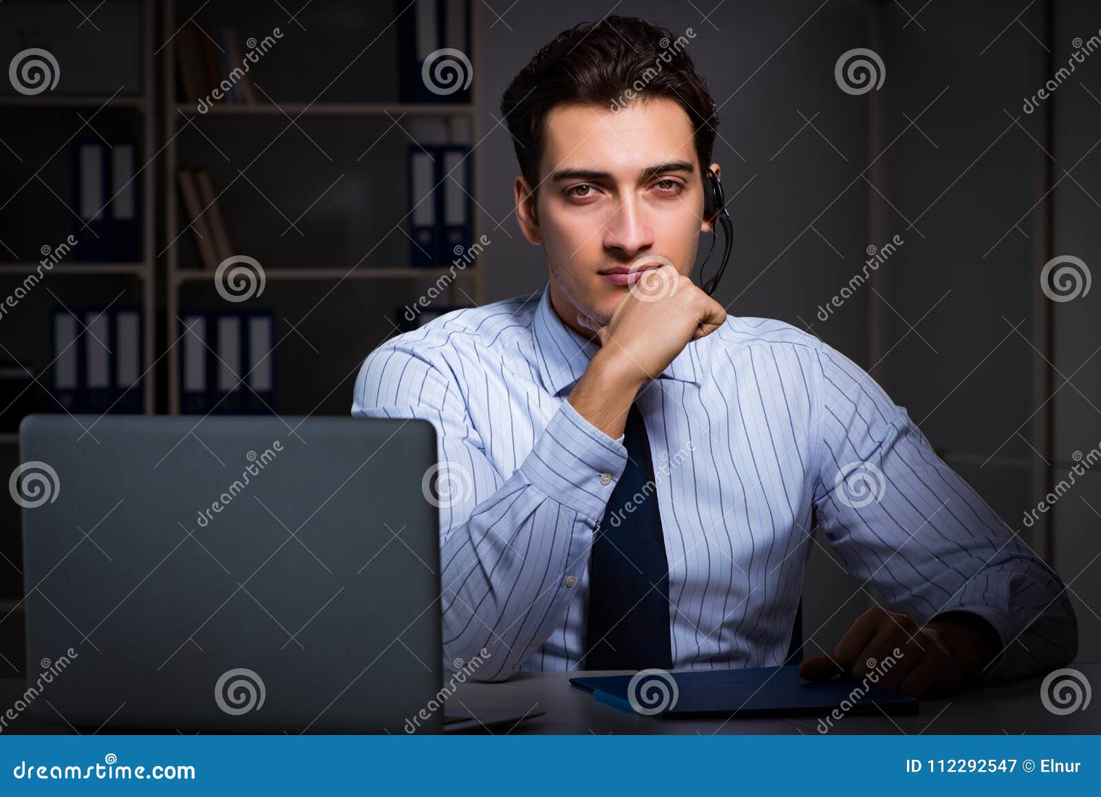 The Call Center Operator Talking To Customer during Night Shift Stock ...