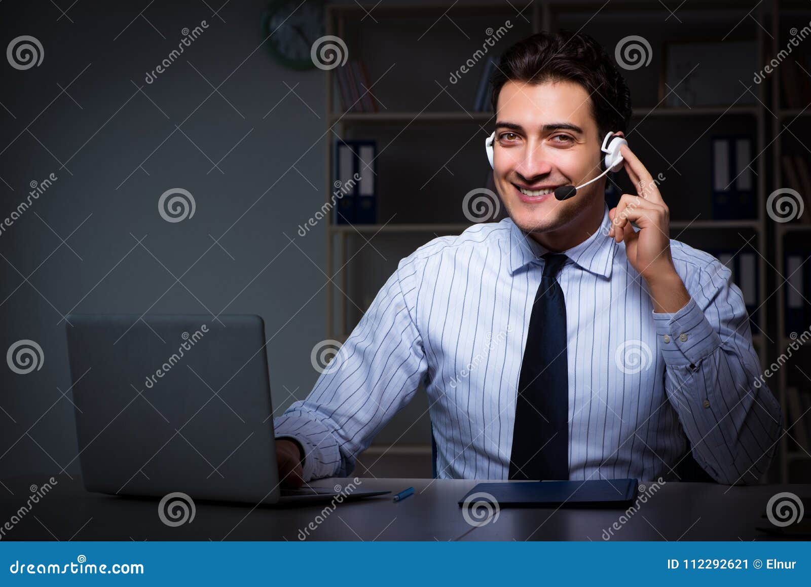 The Call Center Operator Talking To Customer during Night Shift Stock ...