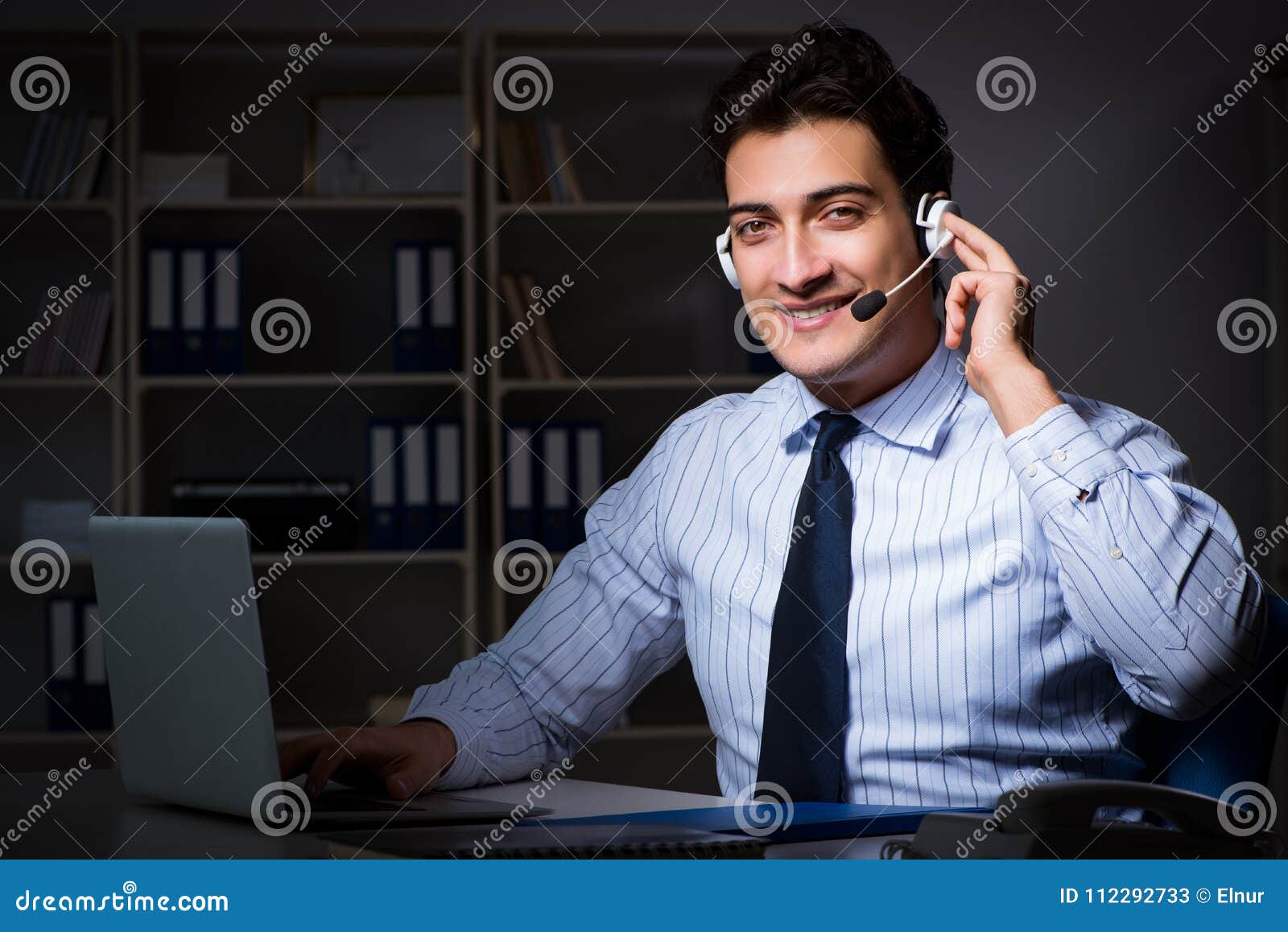The Call Center Operator Talking To Customer during Night Shift Stock ...