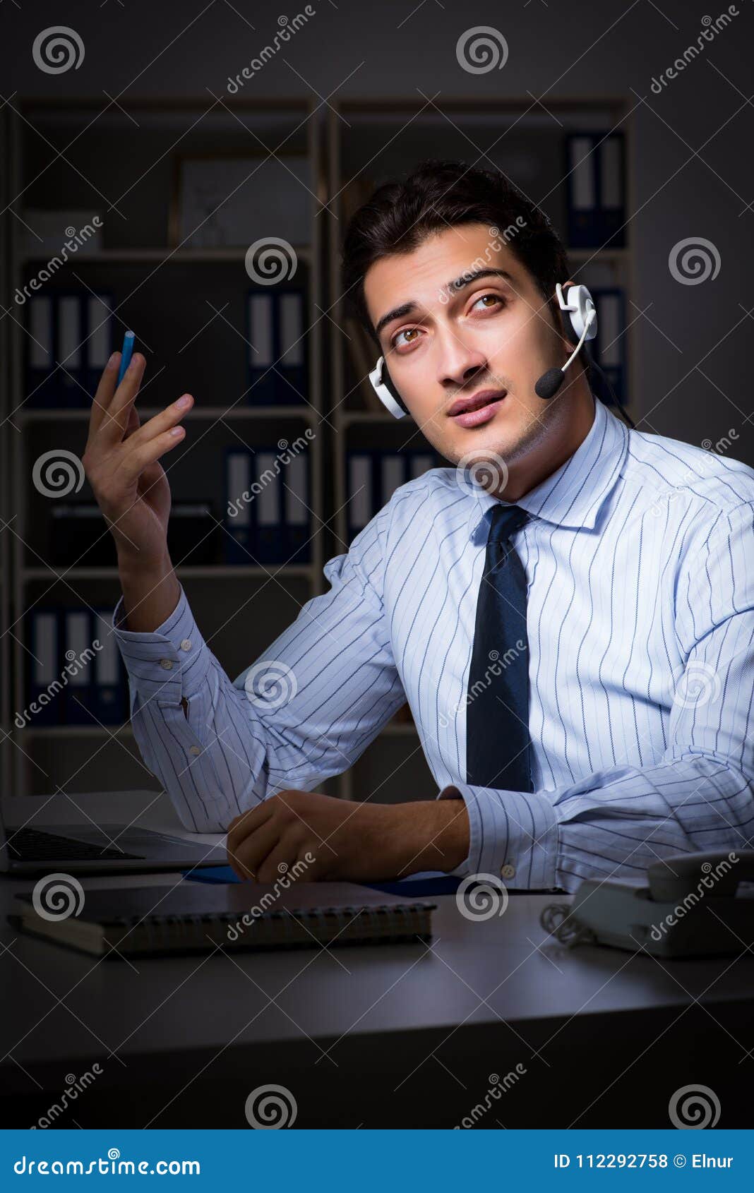 The Call Center Operator Talking To Customer during Night Shift Stock ...