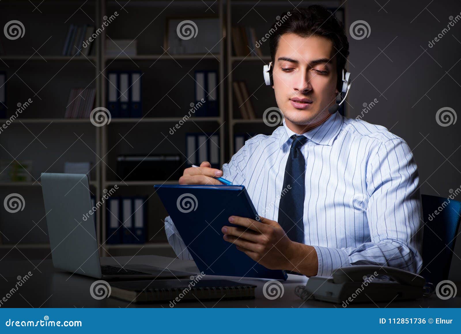 The Call Center Operator Talking To Customer during Night Shift Stock ...