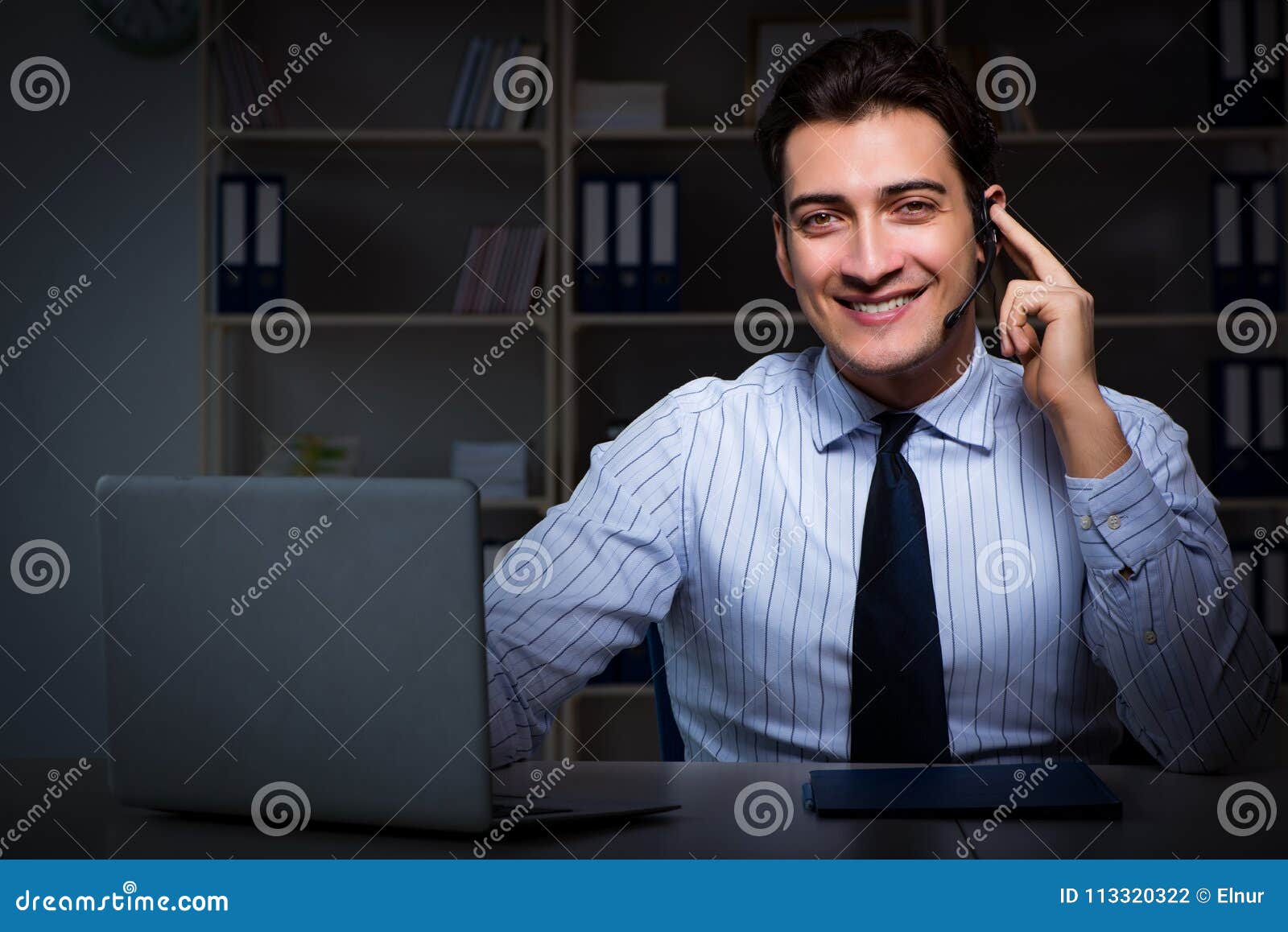 The Call Center Operator Talking To Customer during Night Shift Stock ...