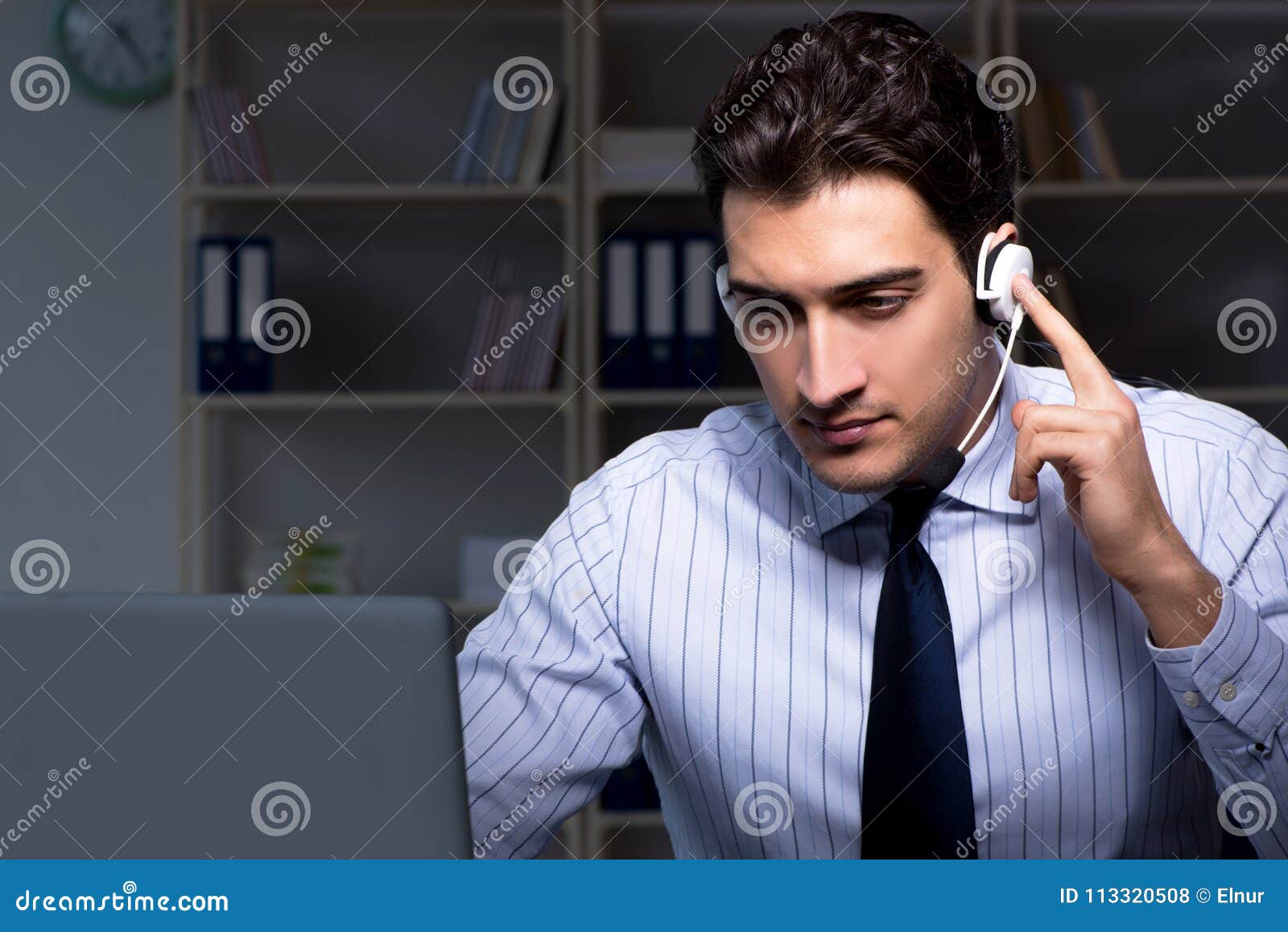 The Call Center Operator Talking To Customer during Night Shift Stock ...