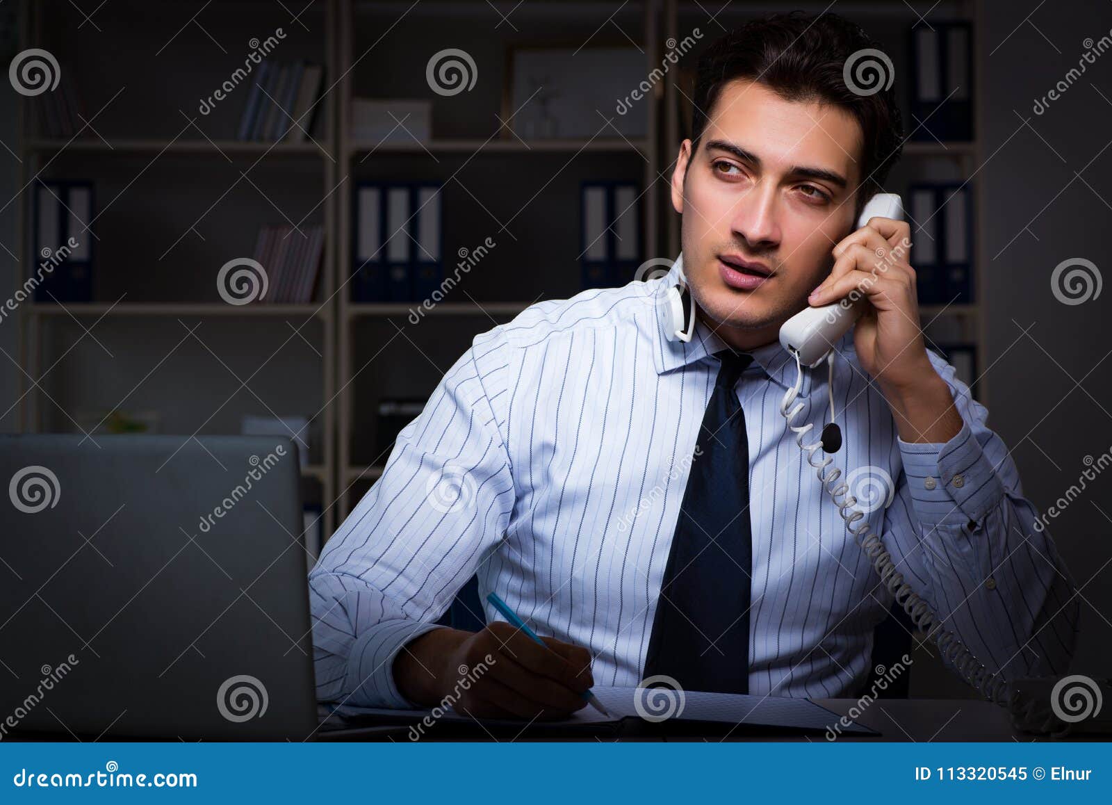 The Call Center Operator Talking To Customer during Night Shift Stock ...