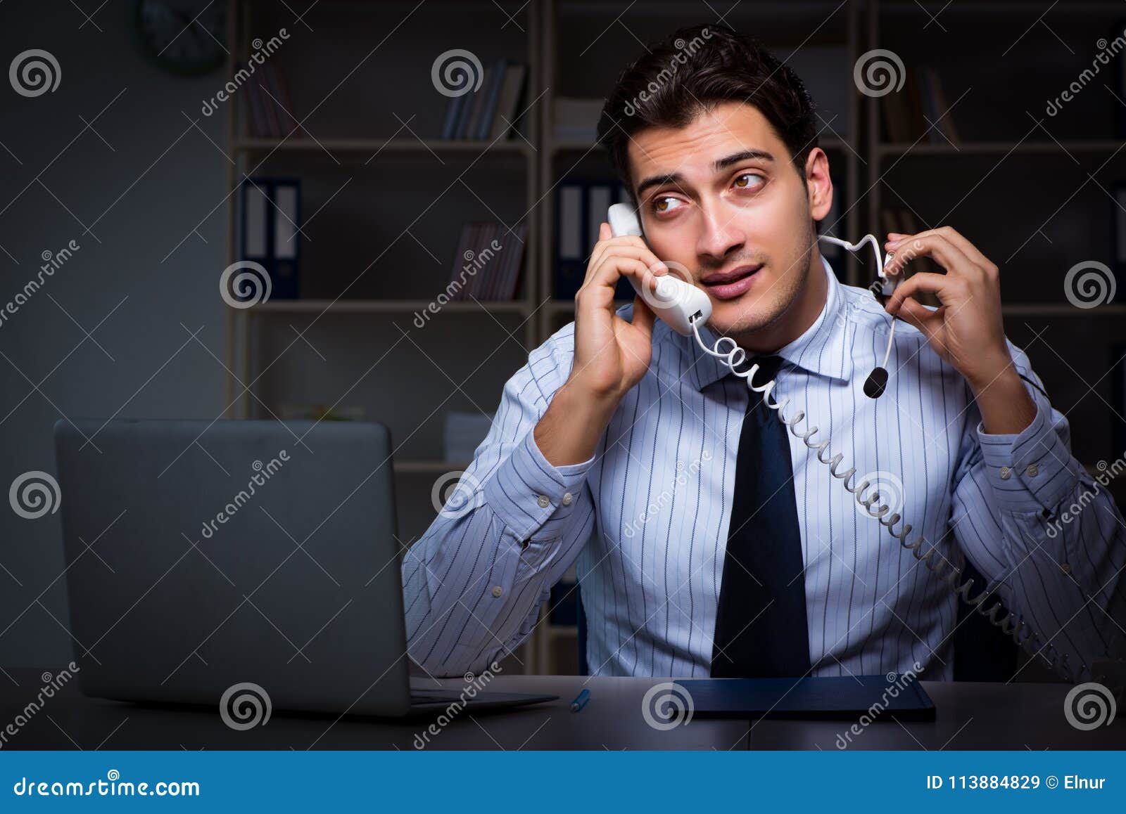 The Call Center Operator Talking To Customer during Night Shift Stock ...