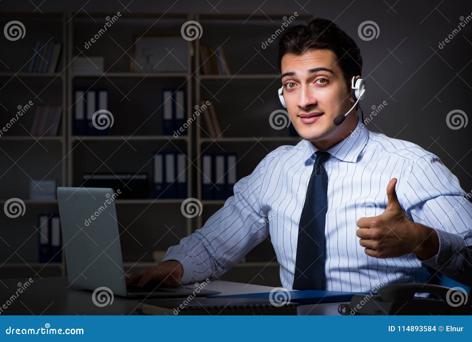 The Call Center Operator Talking To Customer during Night Shift Stock ...