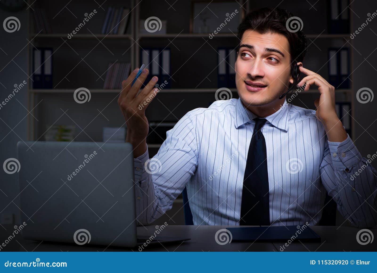 The Call Center Operator Talking To Customer during Night Shift Stock ...