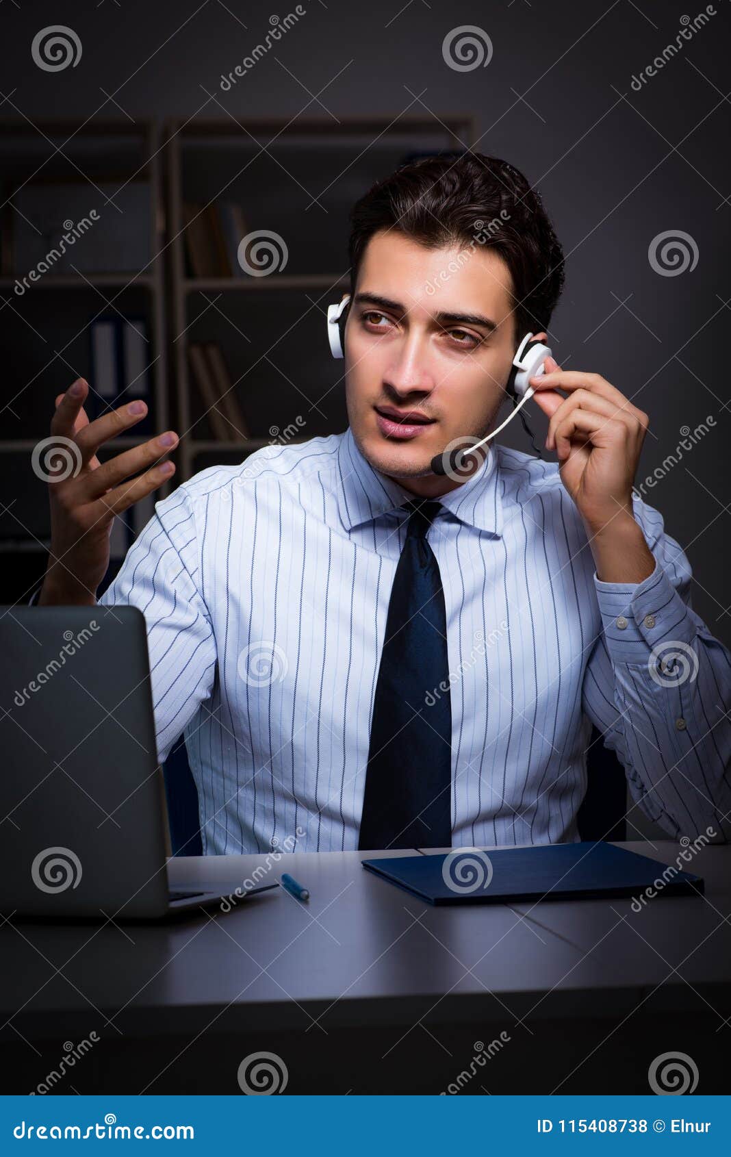 The Call Center Operator Talking To Customer during Night Shift Stock ...