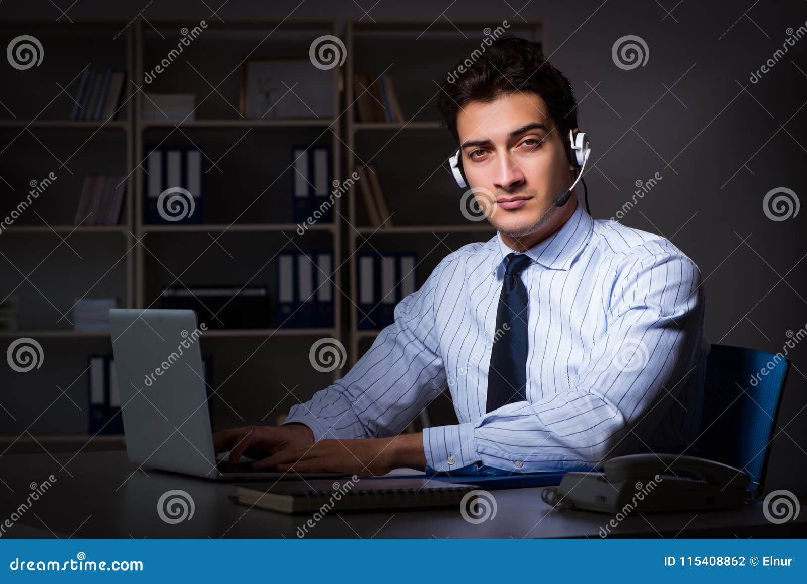 The Call Center Operator Talking To Customer during Night Shift Stock ...