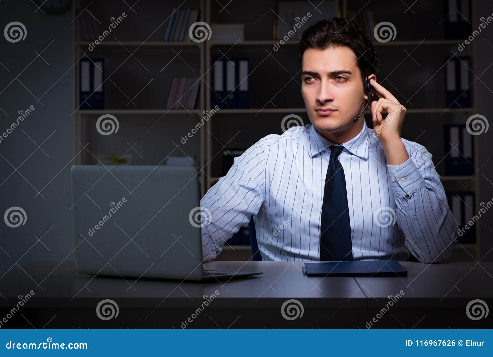 The Call Center Operator Talking To Customer during Night Shift Stock ...