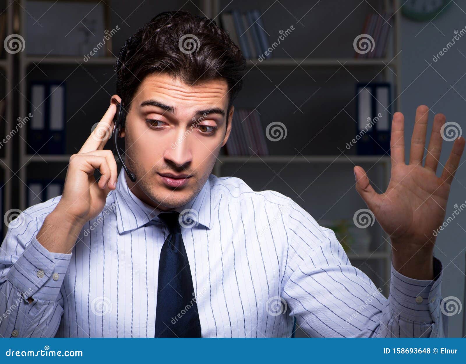 Call Center Operator Talking To Customer during Night Shift Stock Photo ...