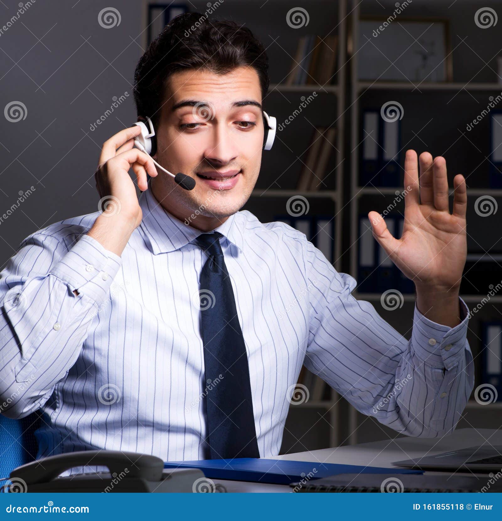 Call Center Operator Talking To Customer during Night Shift Stock Photo ...