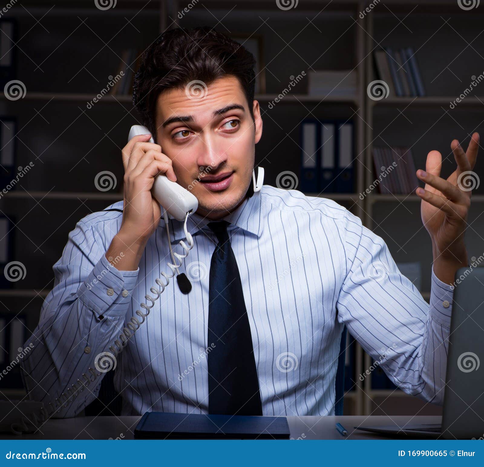 Call Center Operator Talking To Customer during Night Shift Stock Image ...