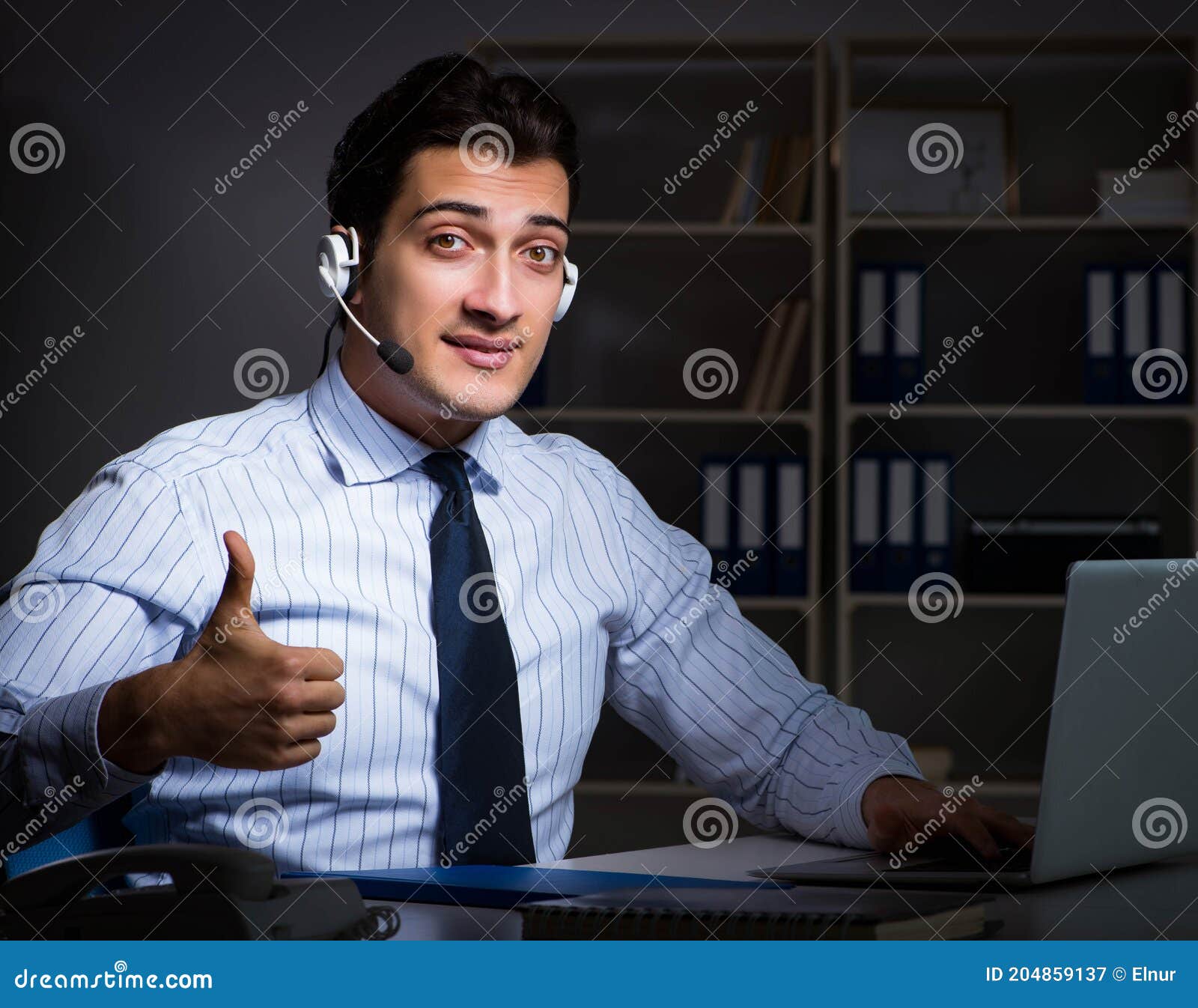 Call Center Operator Talking To Customer during Night Shift Stock Image ...