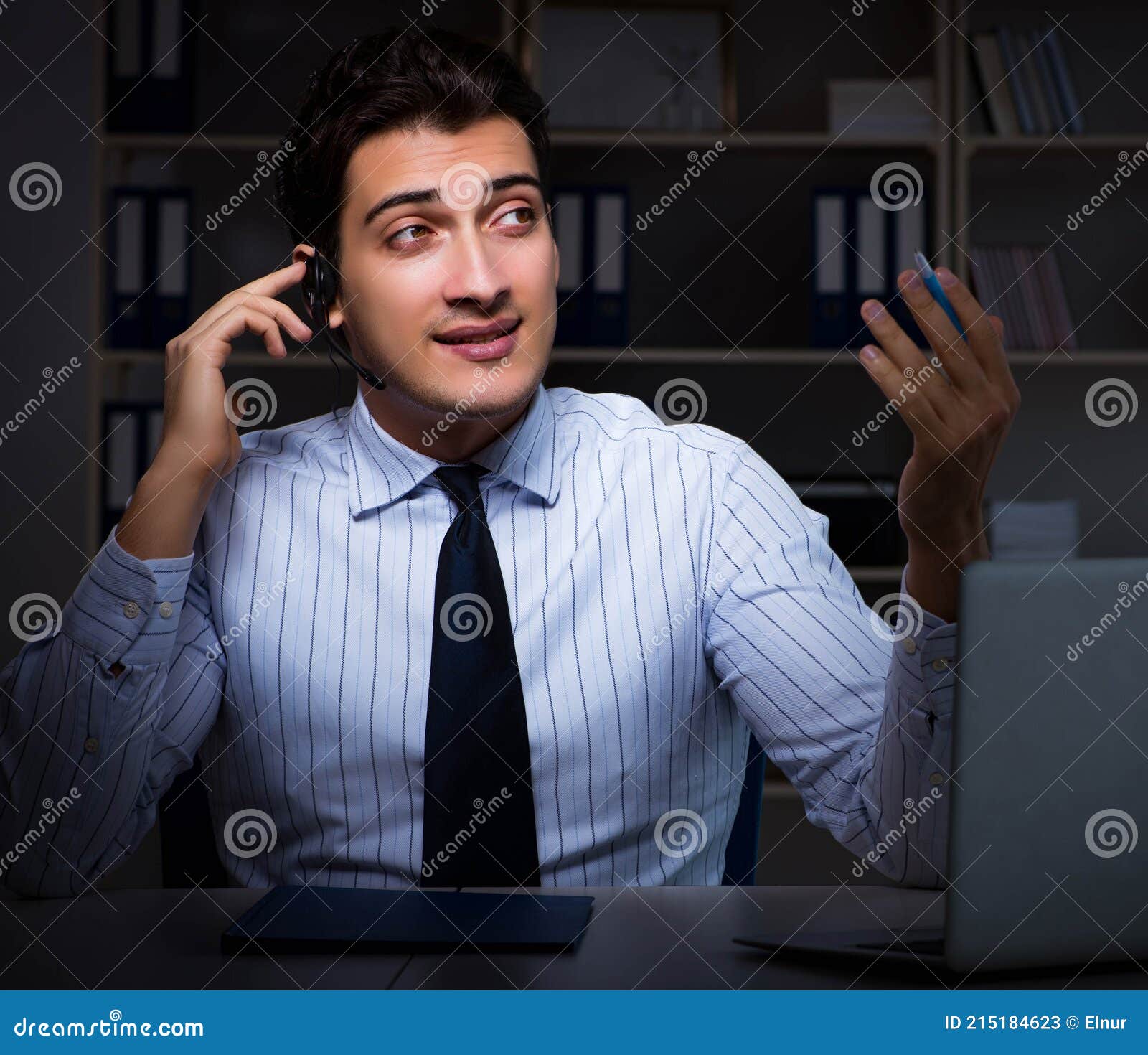 Call Center Operator Talking To Customer during Night Shift Stock Image ...