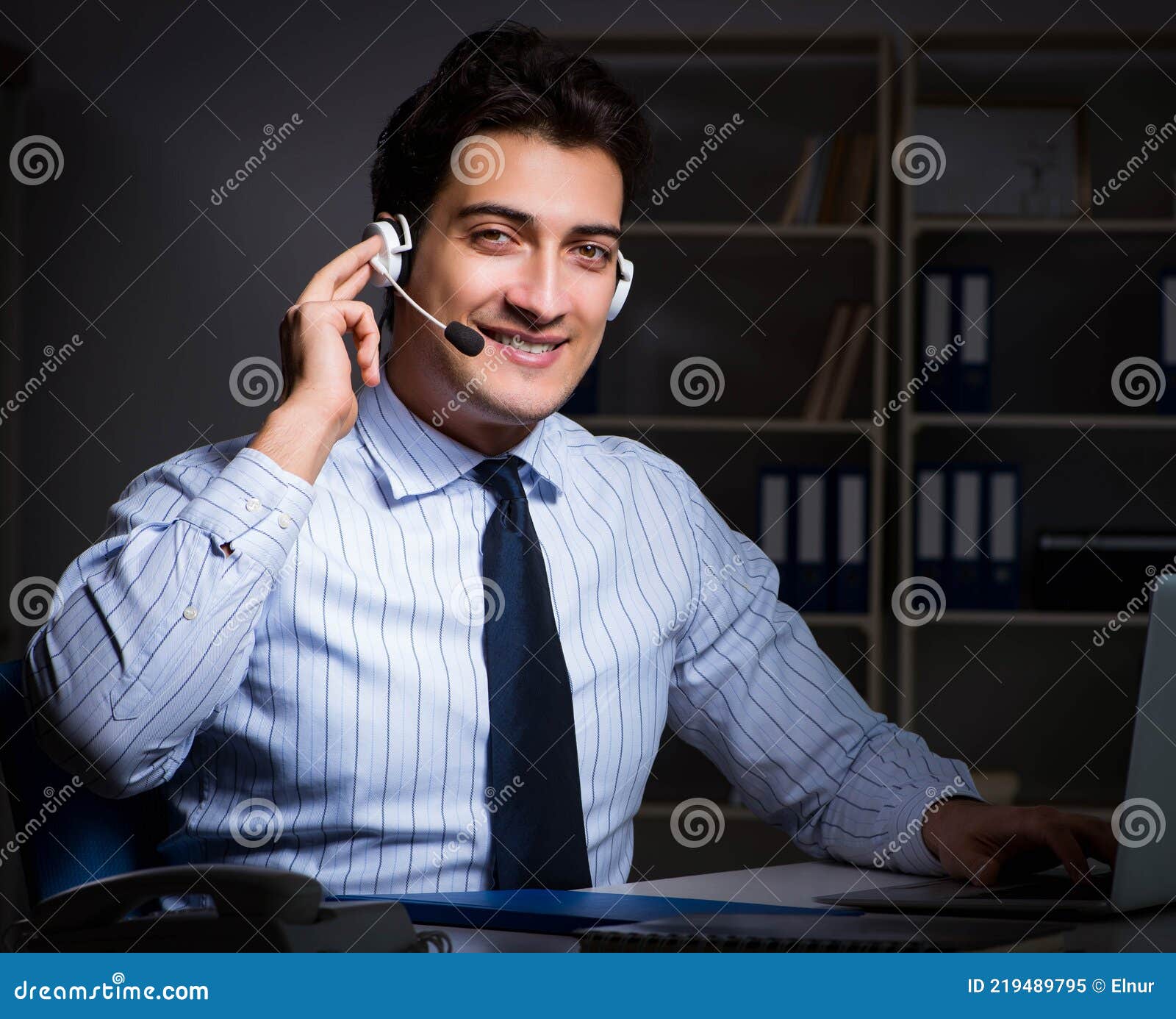 Call Center Operator Talking To Customer during Night Shift Stock Image ...