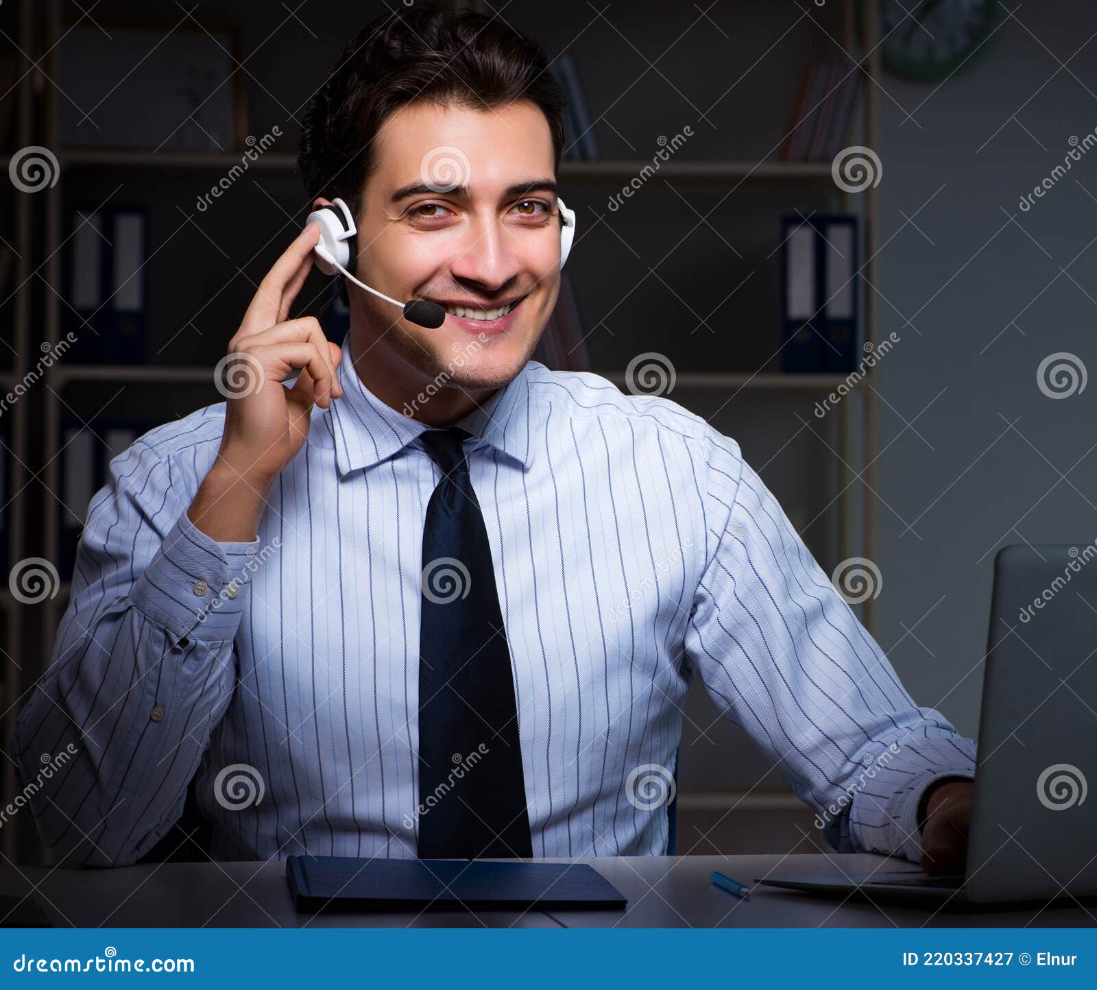 Call Center Operator Talking To Customer during Night Shift Stock Image ...